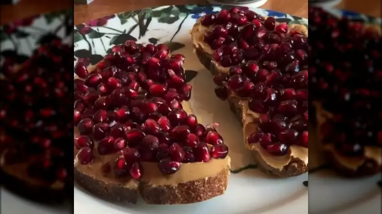 Toast with peanut butter and pomegranate