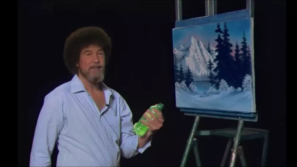 Bob Ross con pintura e botella Mountain Dew