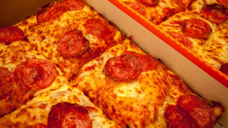 Square sliced deep dish pepperoni pizza