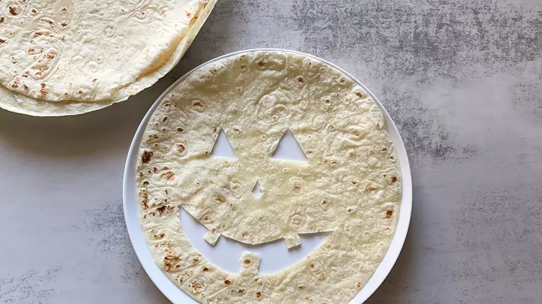 jack-o'-lantern-carved tortilla